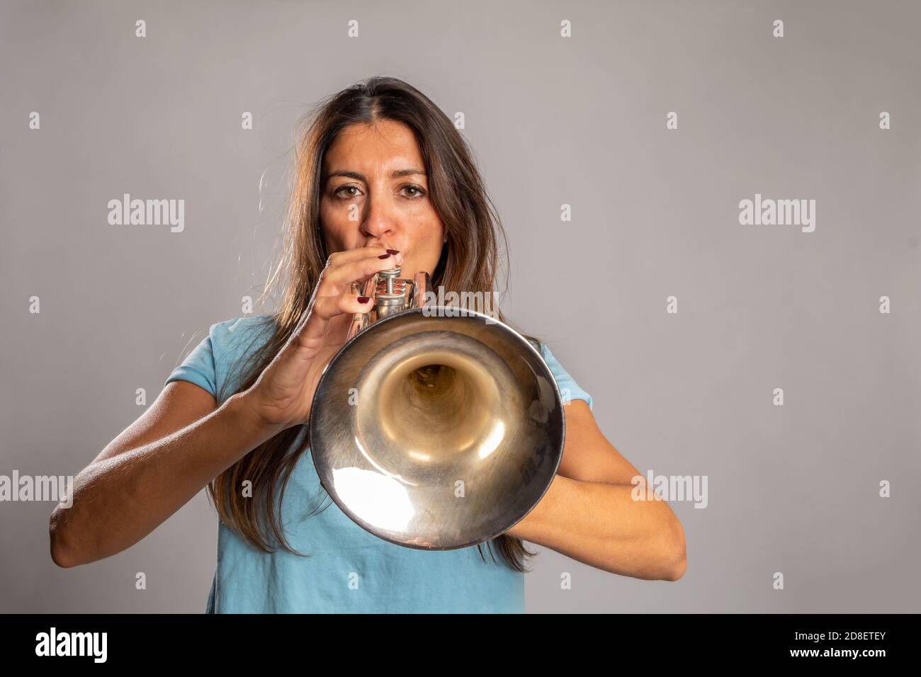 Woman playing trumpet hi-res stock photography and images - Alamy