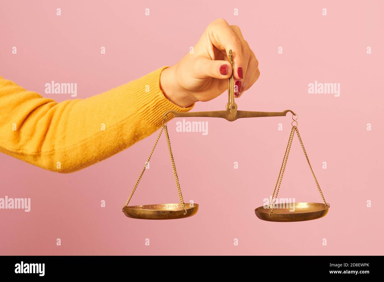 Female hand holding scale justice hi-res stock photography and images ...