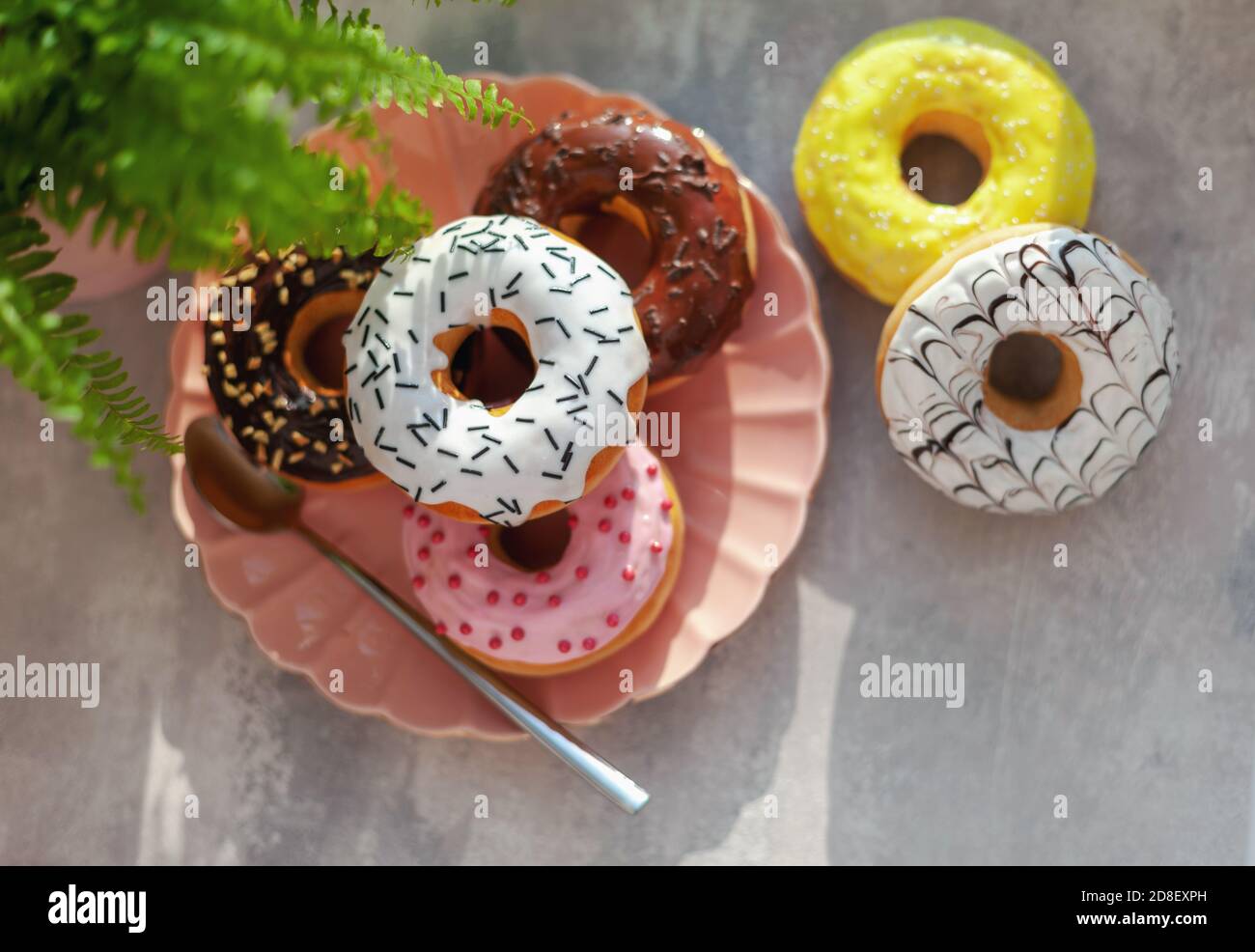 Sweet and fresh colored different donuts with chocolate frosted, glazed ...