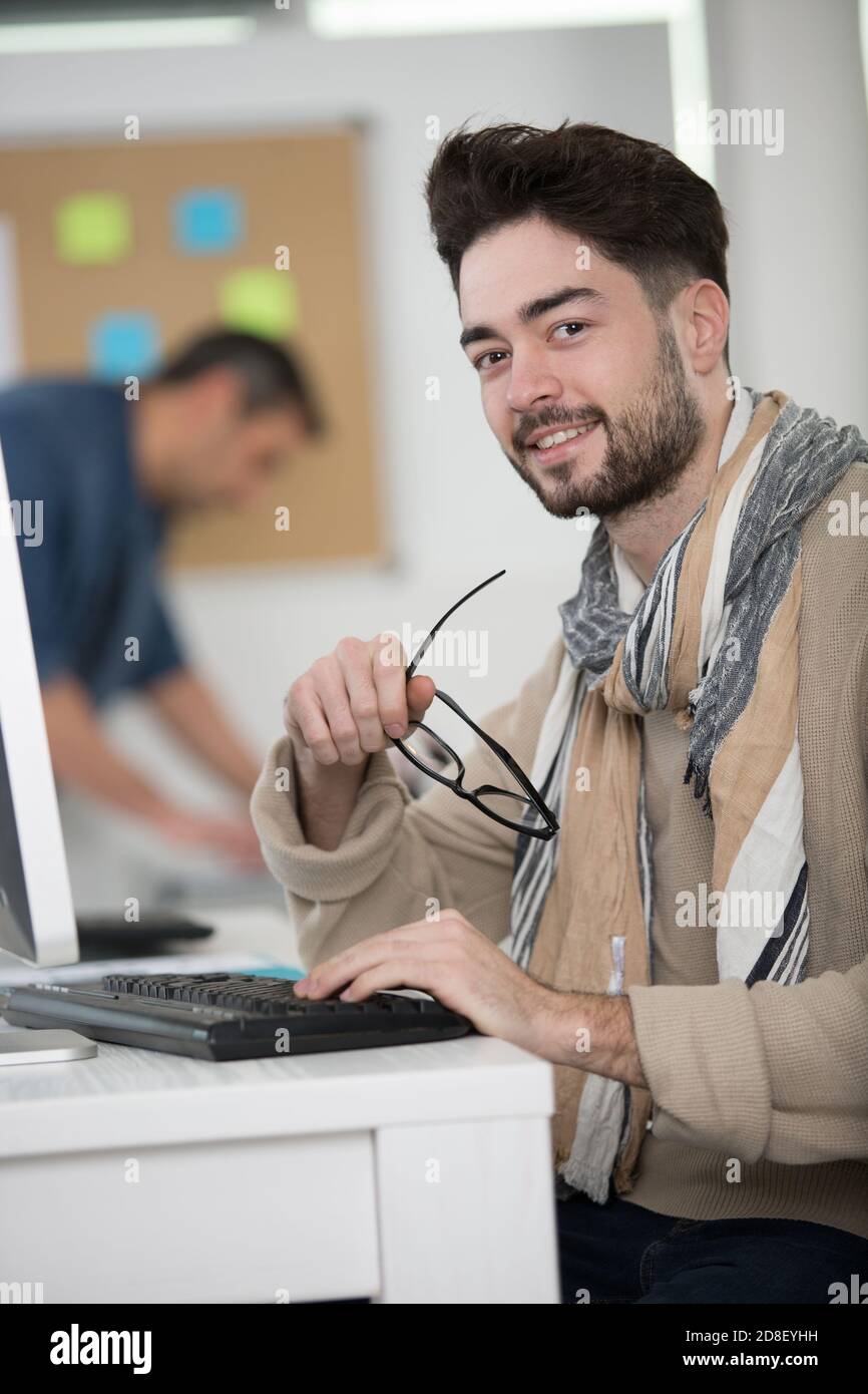 portrait of young man at a computer desk Stock Photo - Alamy