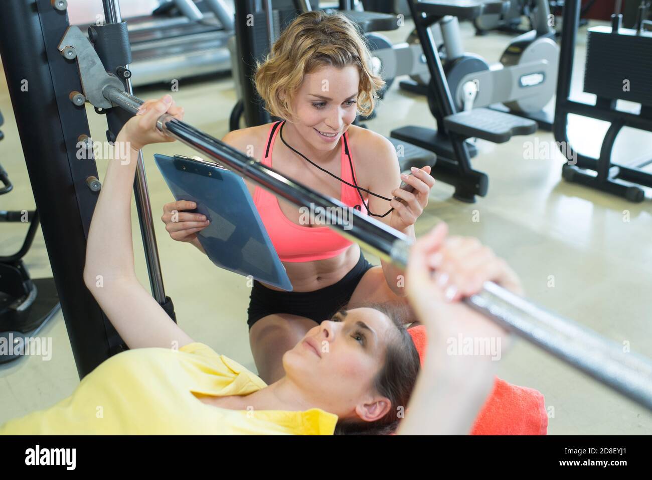 young woman workout with female trainer Stock Photo - Alamy