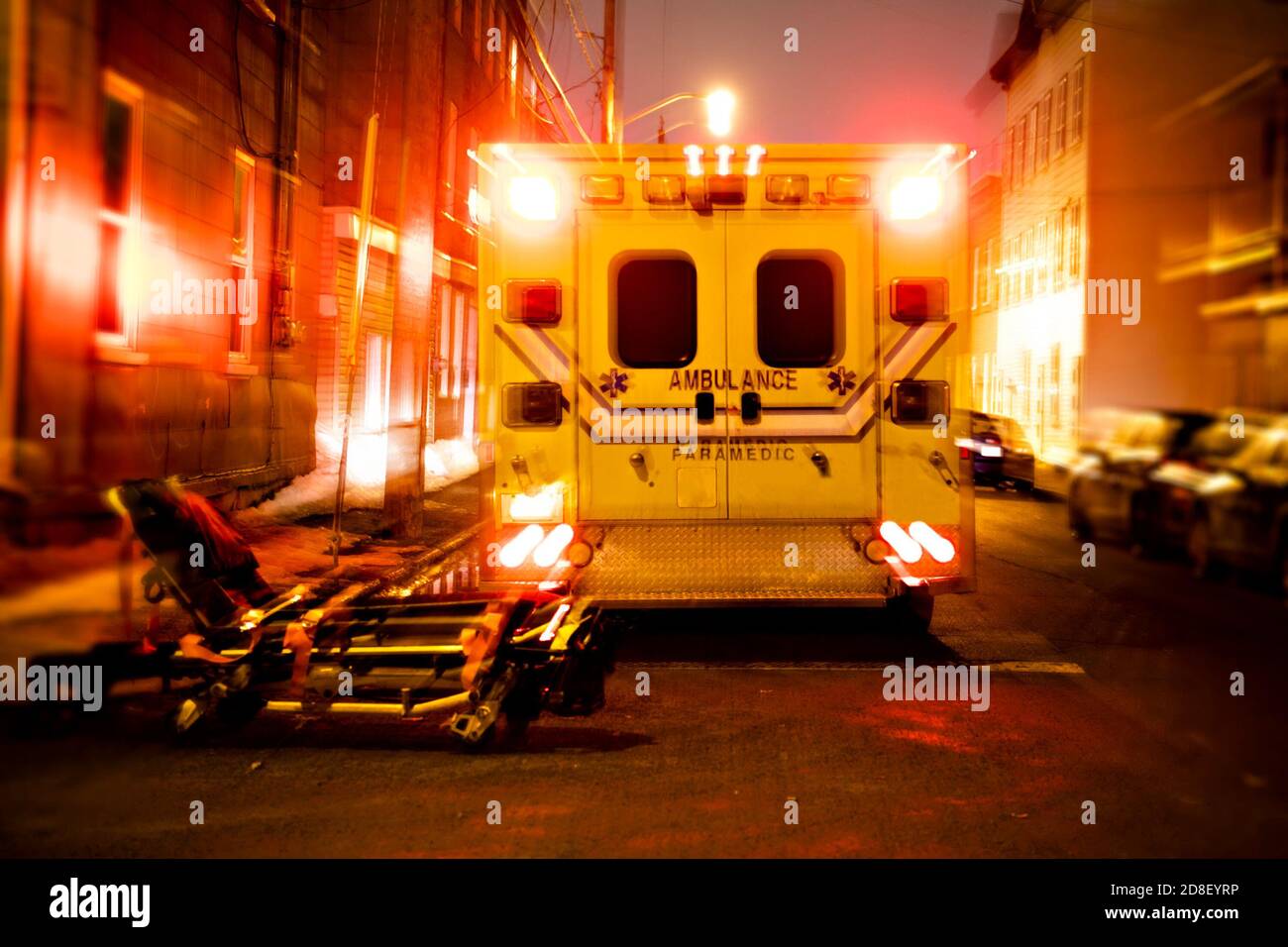 An ambulance car parked on the side street at night Stock Photo - Alamy