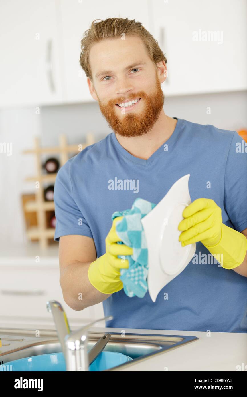 Man gloves washing up brush hi-res stock photography and images - Alamy