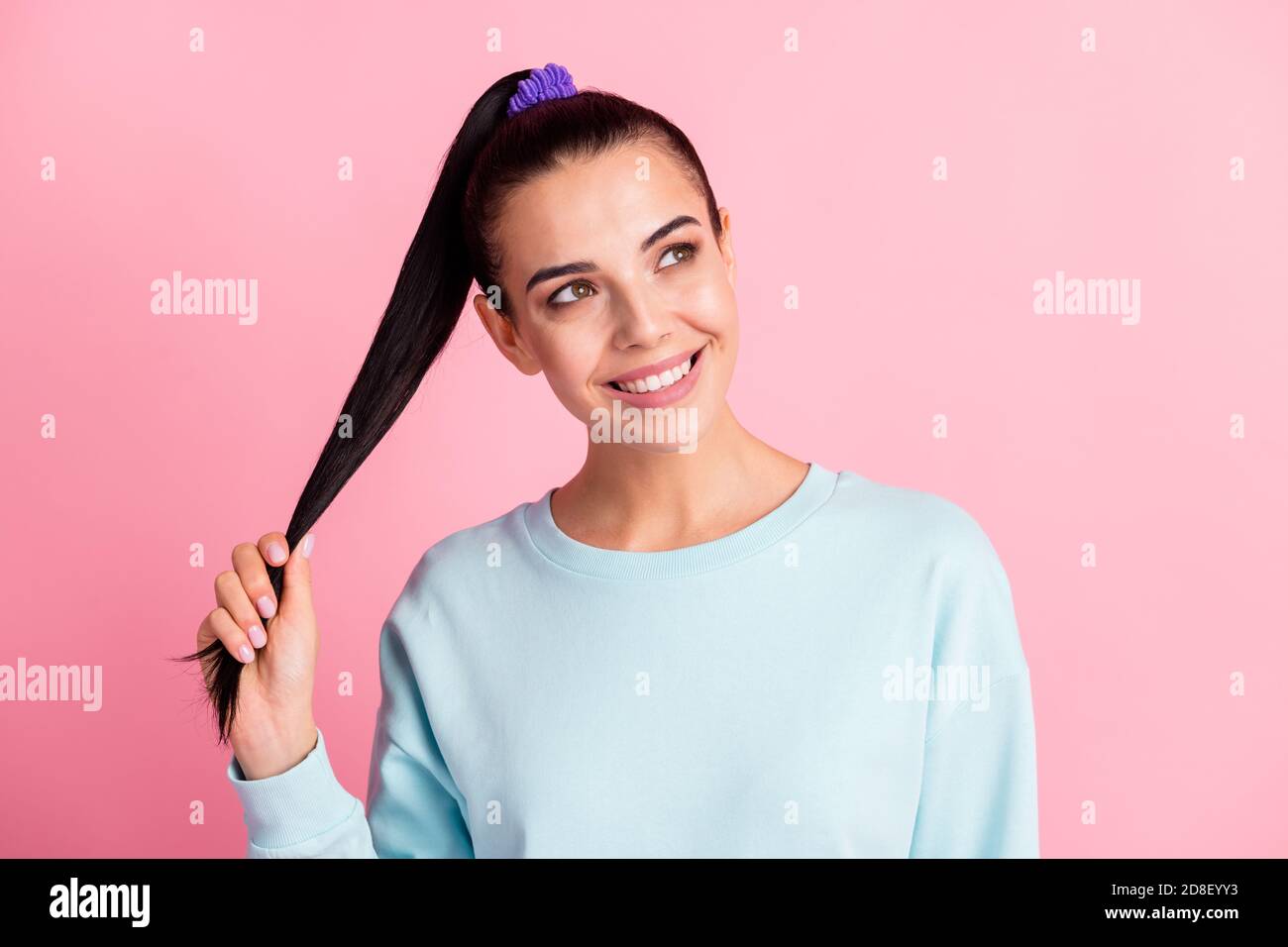 Photo of cute lady good mood look empty space dream hold tail wear ...