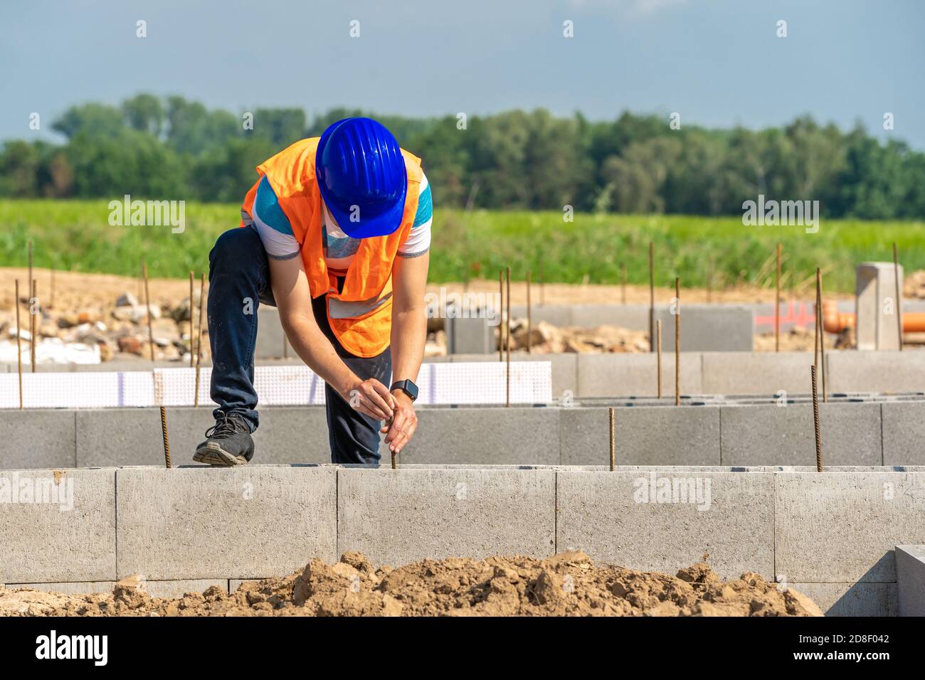 the construction worker builds the foundation of the building Stock ...