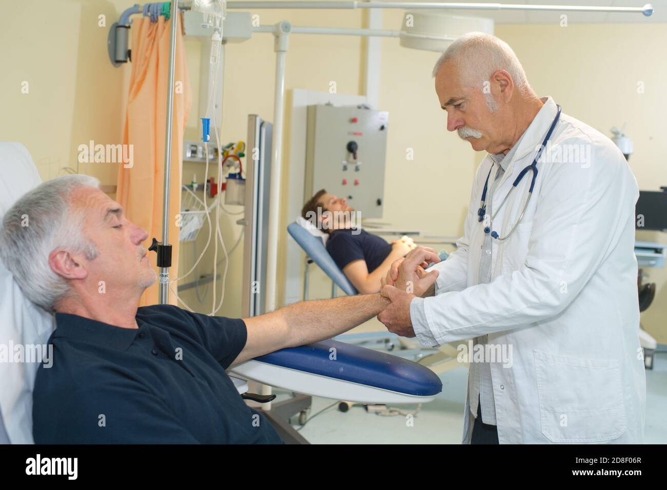 male doctor collecting blood from patient Stock Photo - Alamy
