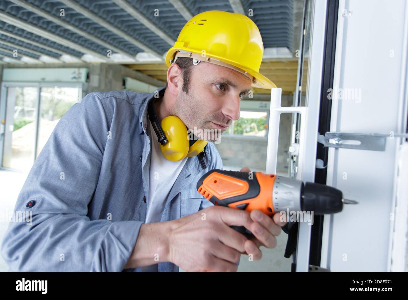 male worker carpenter at internal door installation Stock Photo - Alamy