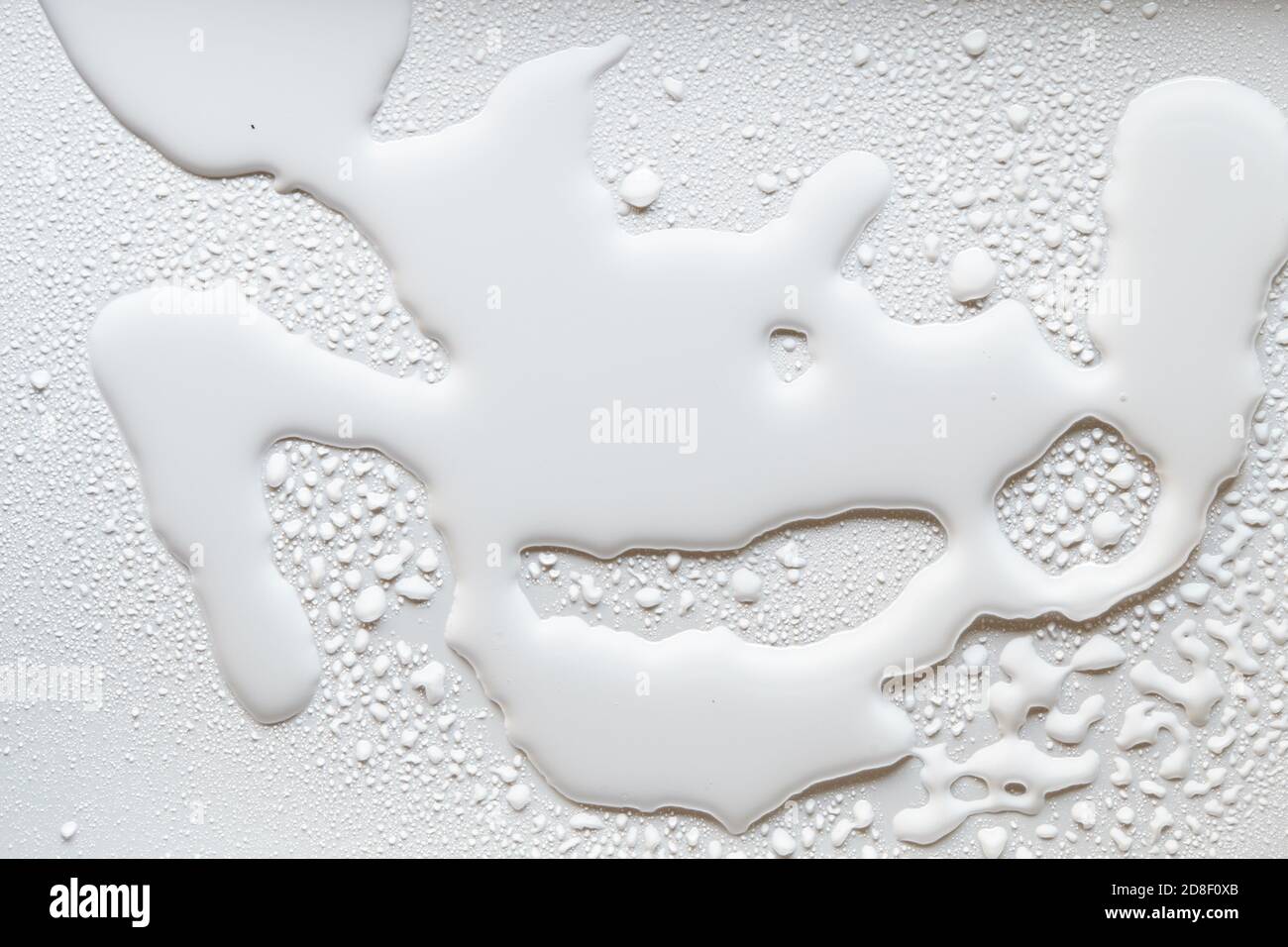 White drops water and milk Stock Photo - Alamy
