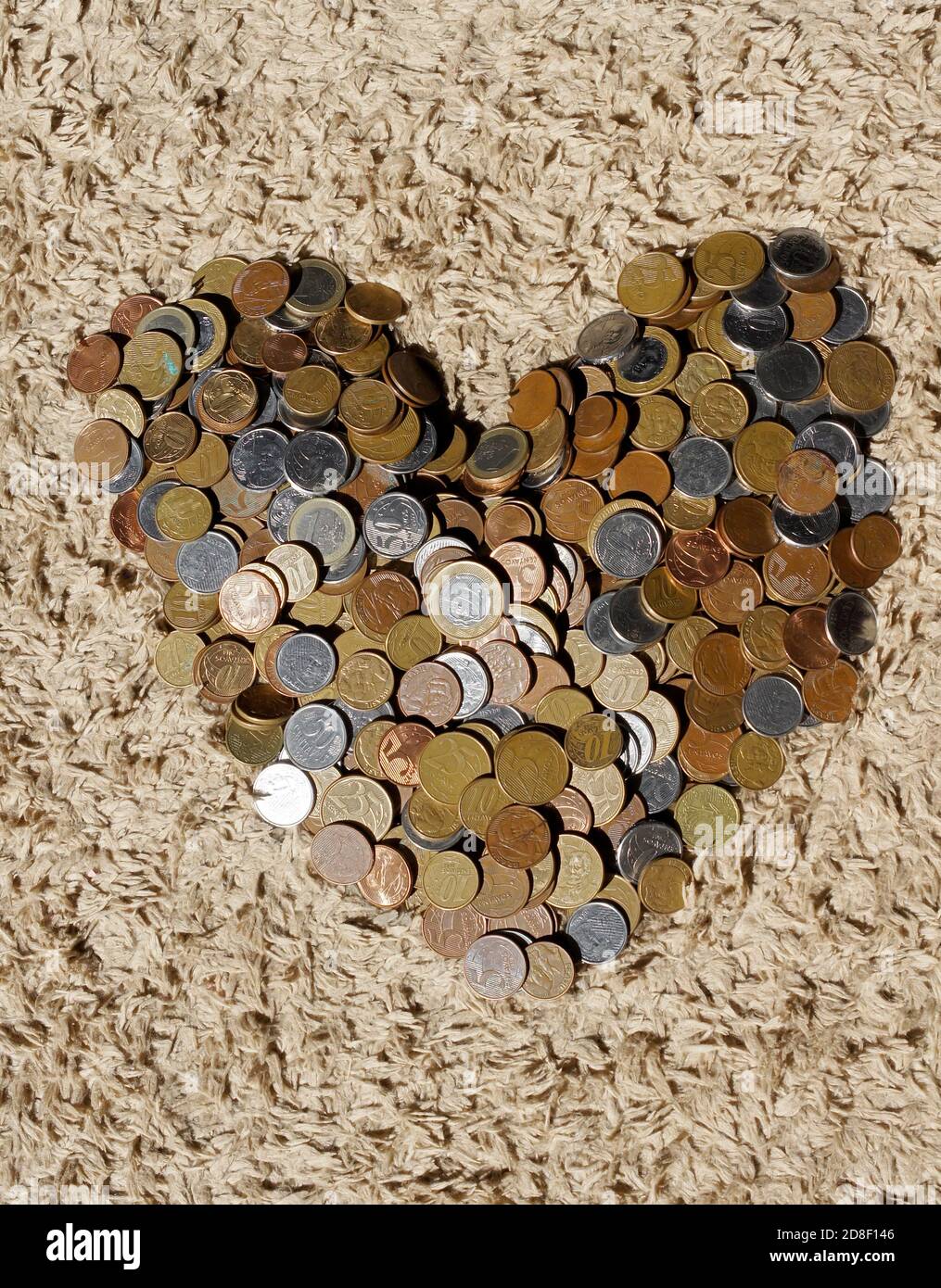 Heart made of Brazilian coins Stock Photo - Alamy