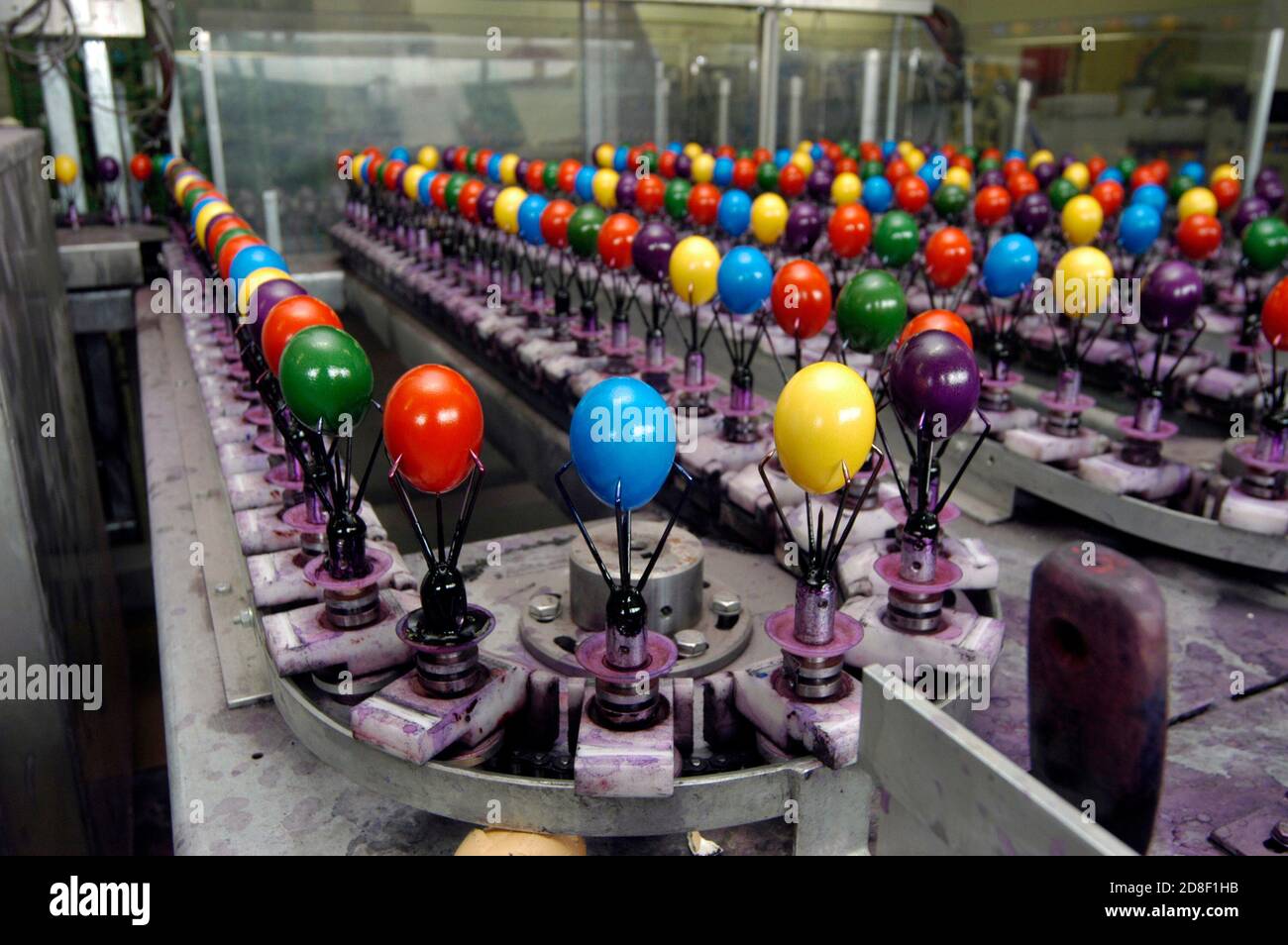 industrial mass production of colorful easter eggs in a factory Stock ...