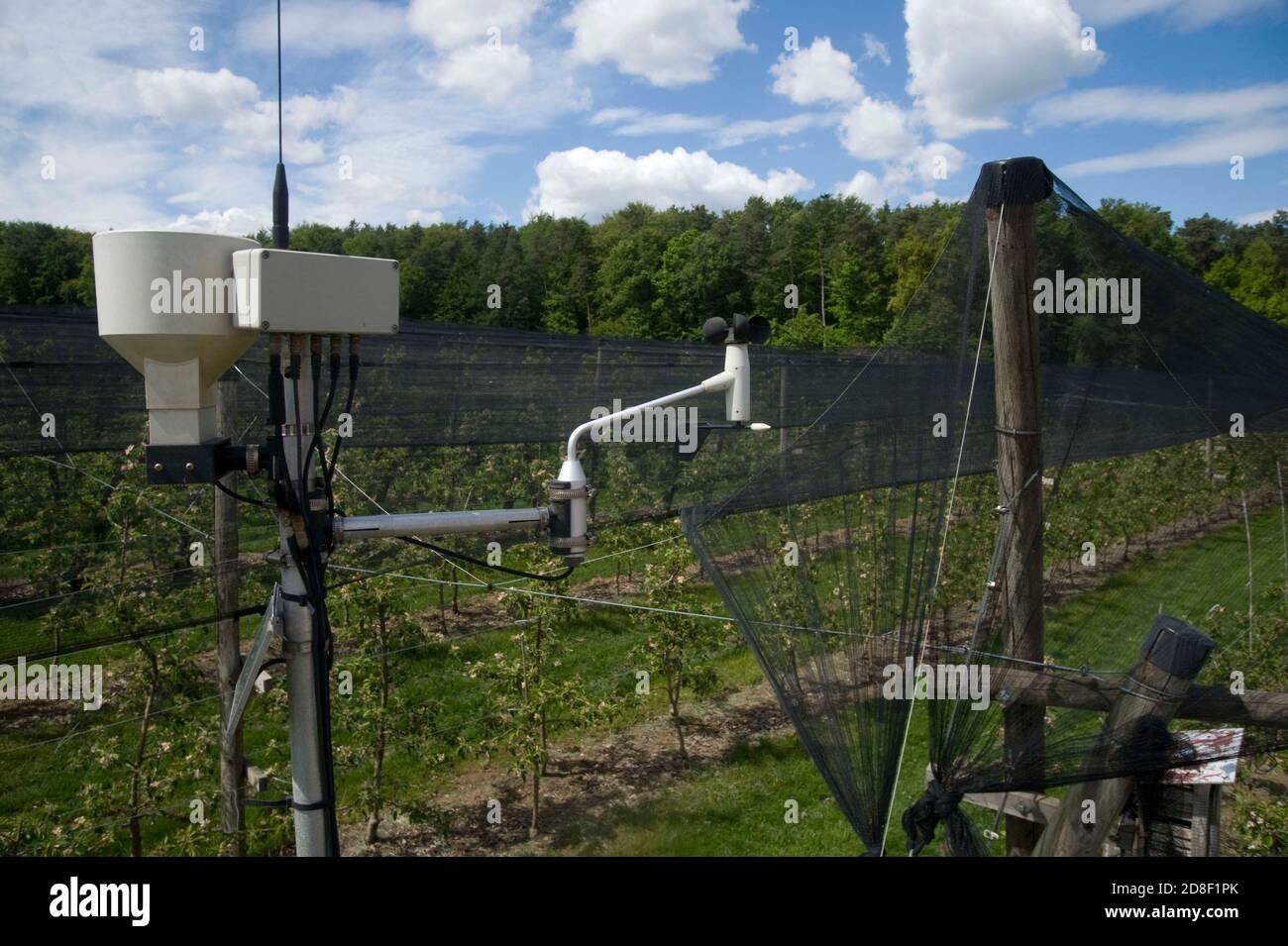 outdoor weather observation station in agriculture, blue sky and forest ...