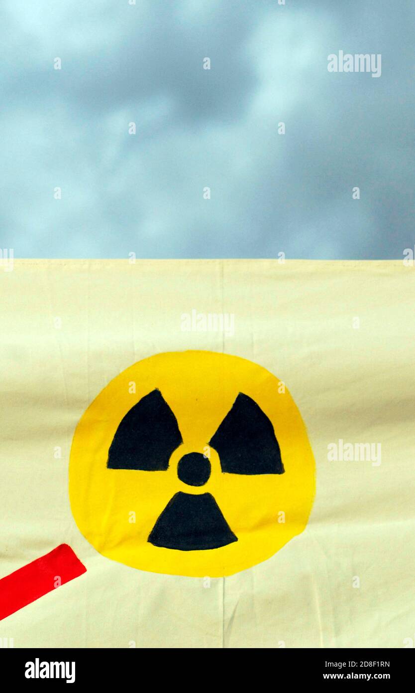 banner with yellow and black radioactive warning sign, cloudy sky Stock ...