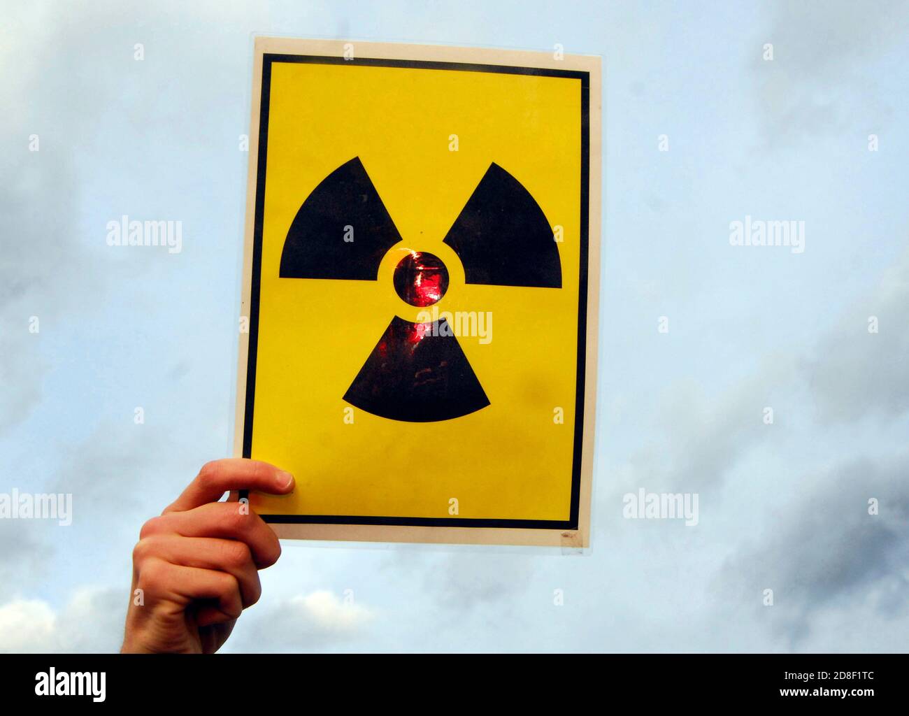 banner with yellow and black radioactive warning sign, cloudy sky Stock ...