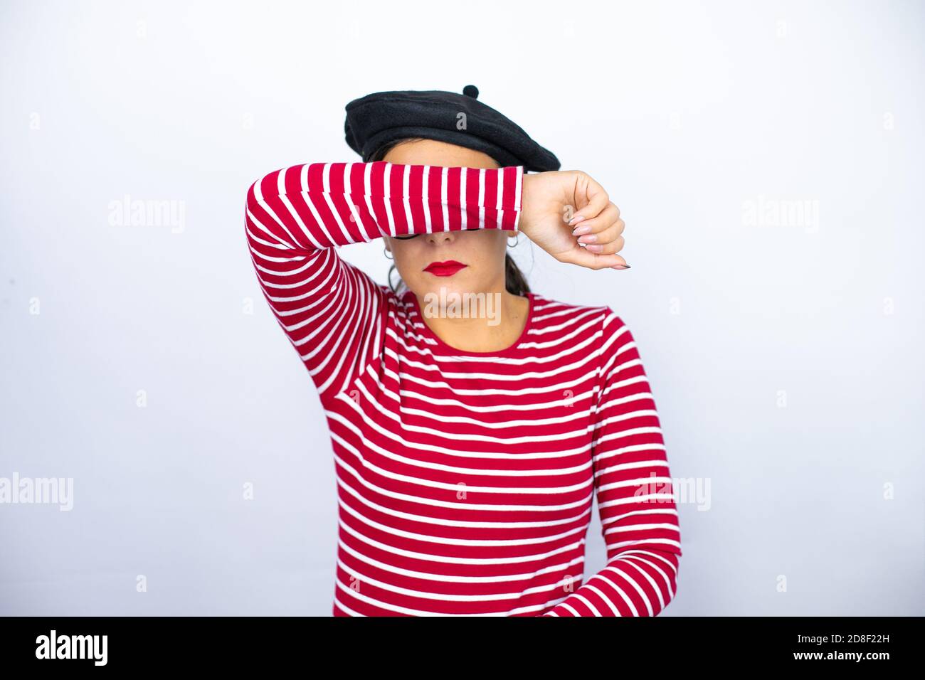 Young beautiful brunette woman wearing french beret and glasses over ...