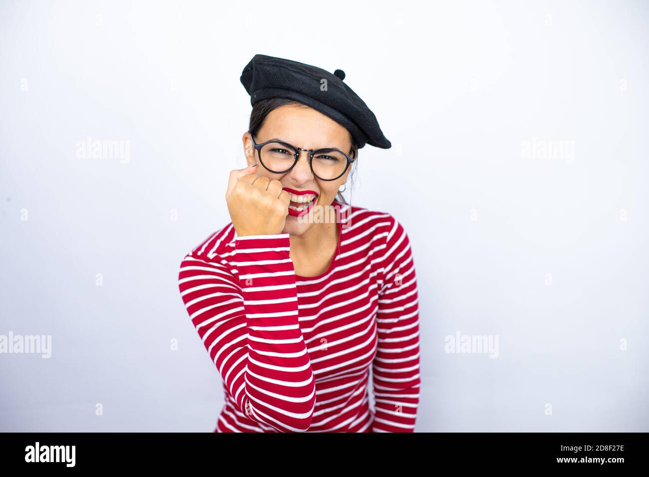 Woman wearing glasses fist punching hi-res stock photography and images ...
