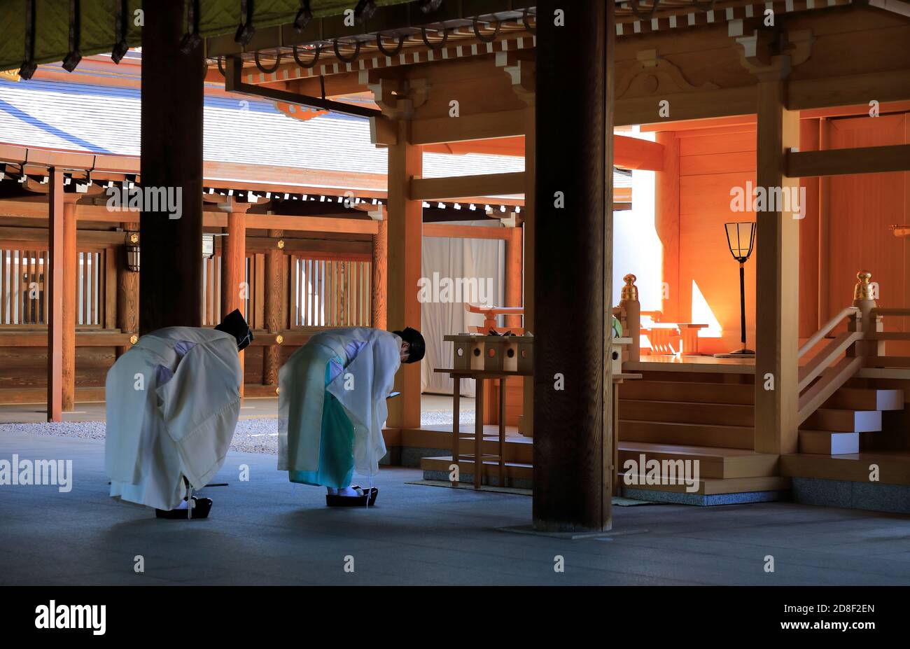 Shinto priests praying inside the main shrine of Meiji Jingu (Meiji ...
