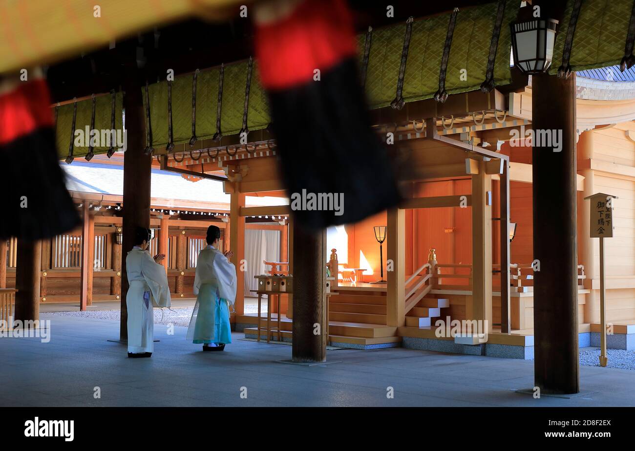 Shinto priests praying inside the main shrine of Meiji Jingu (Meiji ...