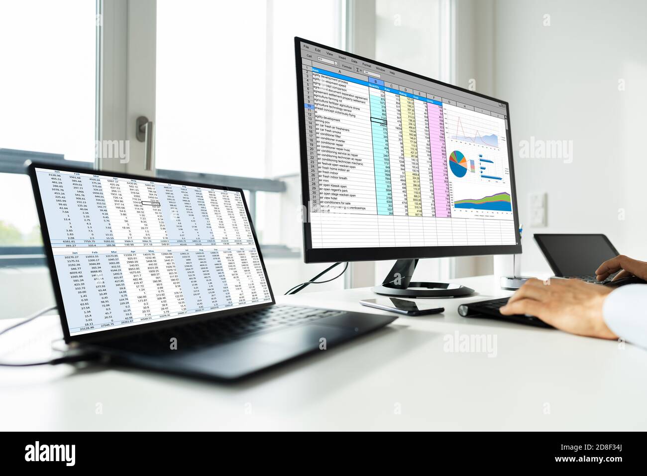 Analyst Employee Working With Spreadsheet On Computer Stock Photo - Alamy