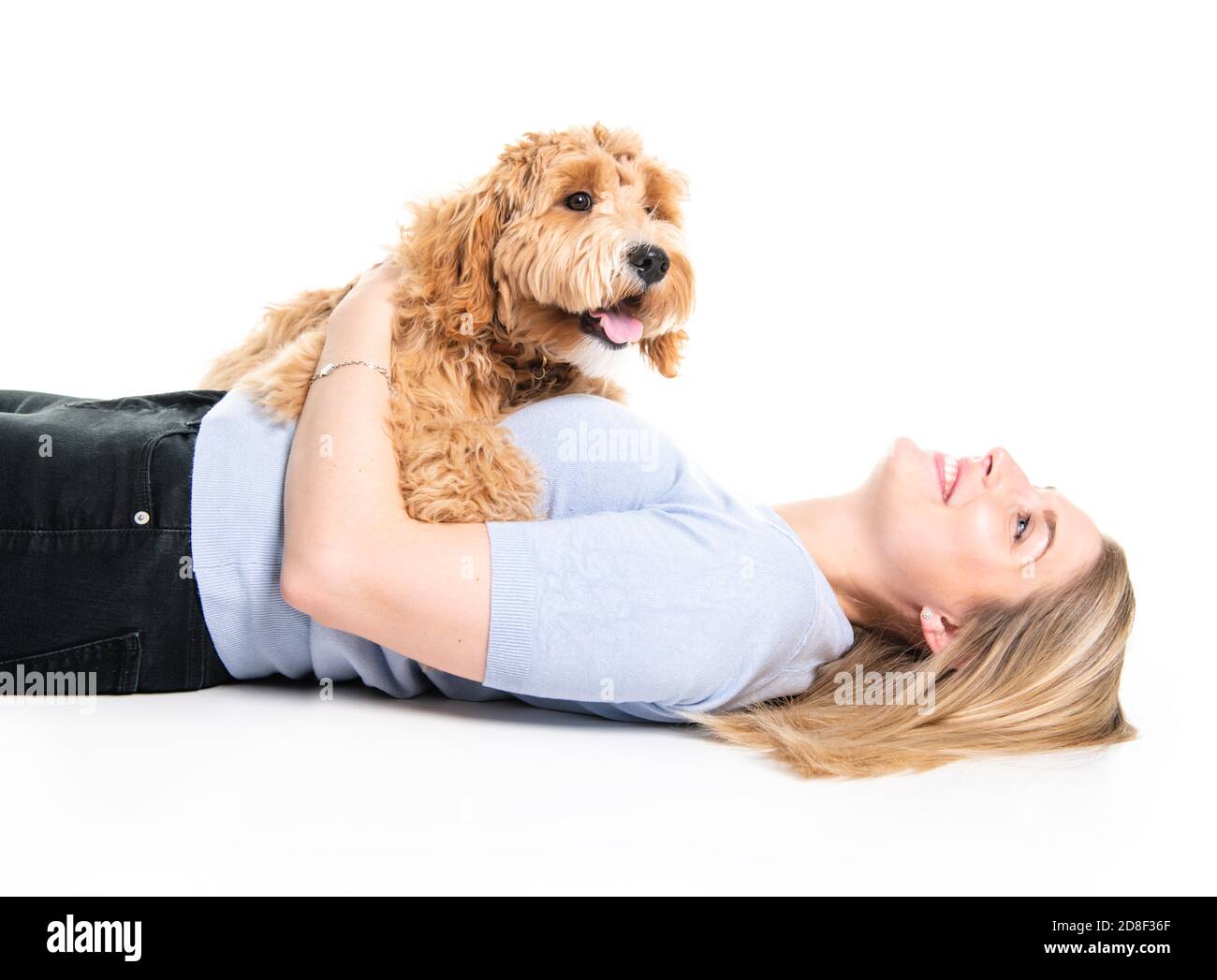 woman with his Golden Labradoodle dog isolated on white background ...