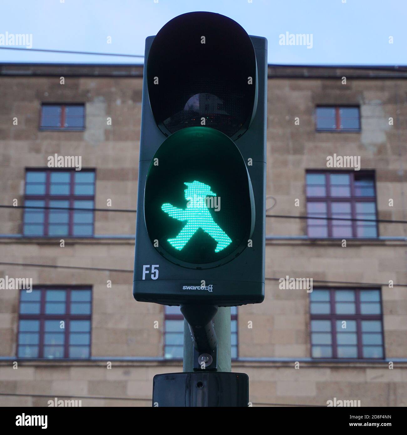 Man walking green go sign hi-res stock photography and images - Alamy