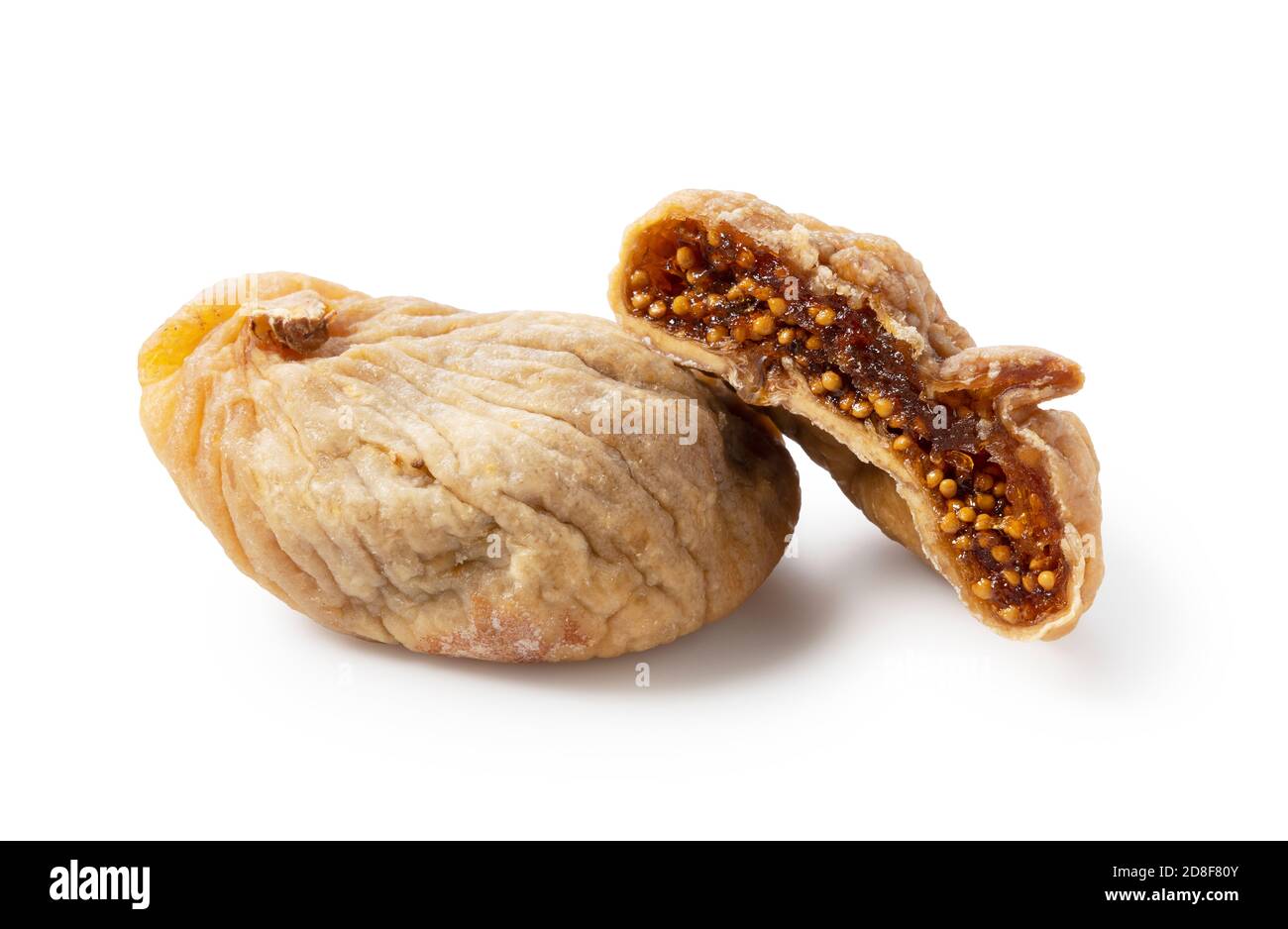 Dried figs and dried figs cut in half on a white background Stock Photo ...