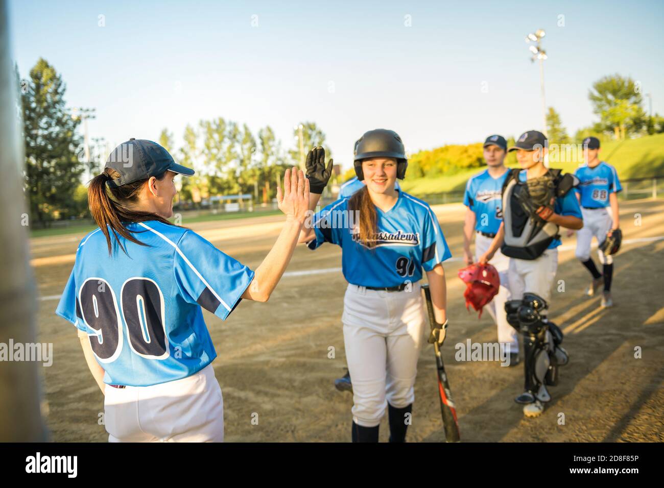 Group of baseball players standing together on the playground with ...