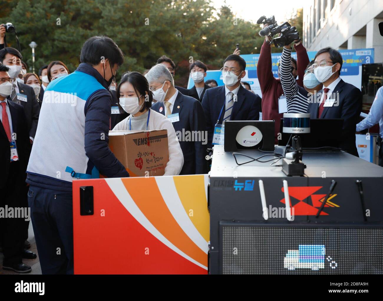Sejong, South Korea. 28th Oct, 2020. Staff members display how a ...