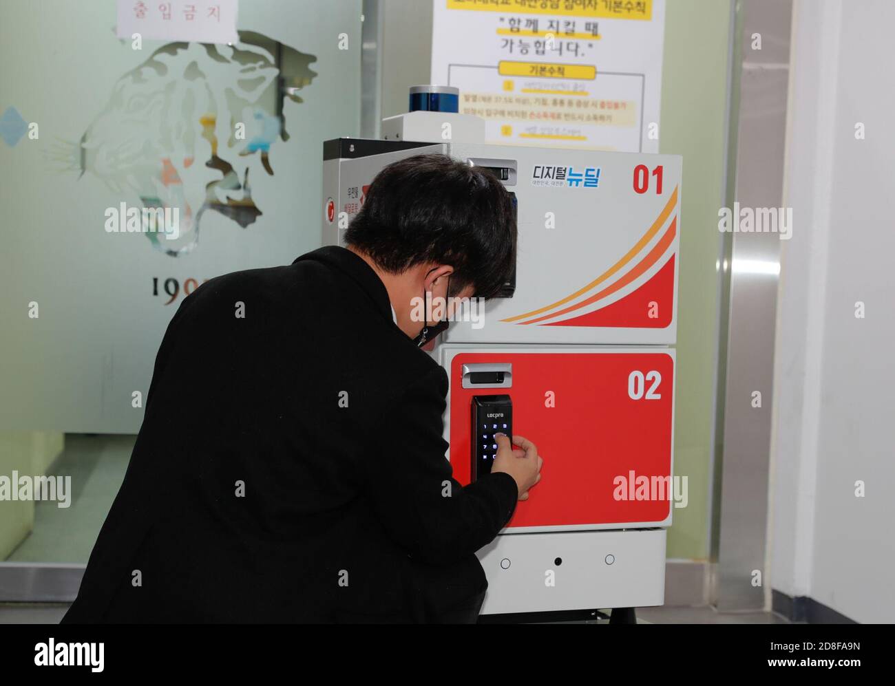 Sejong, South Korea. 28th Oct, 2020. A staff member displays how a ...