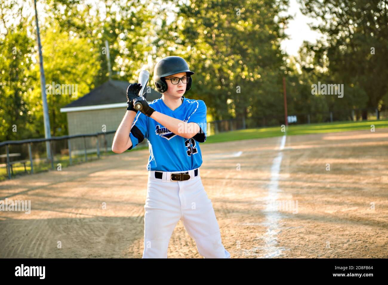 A children baseball players standing with bat on the playground Stock ...