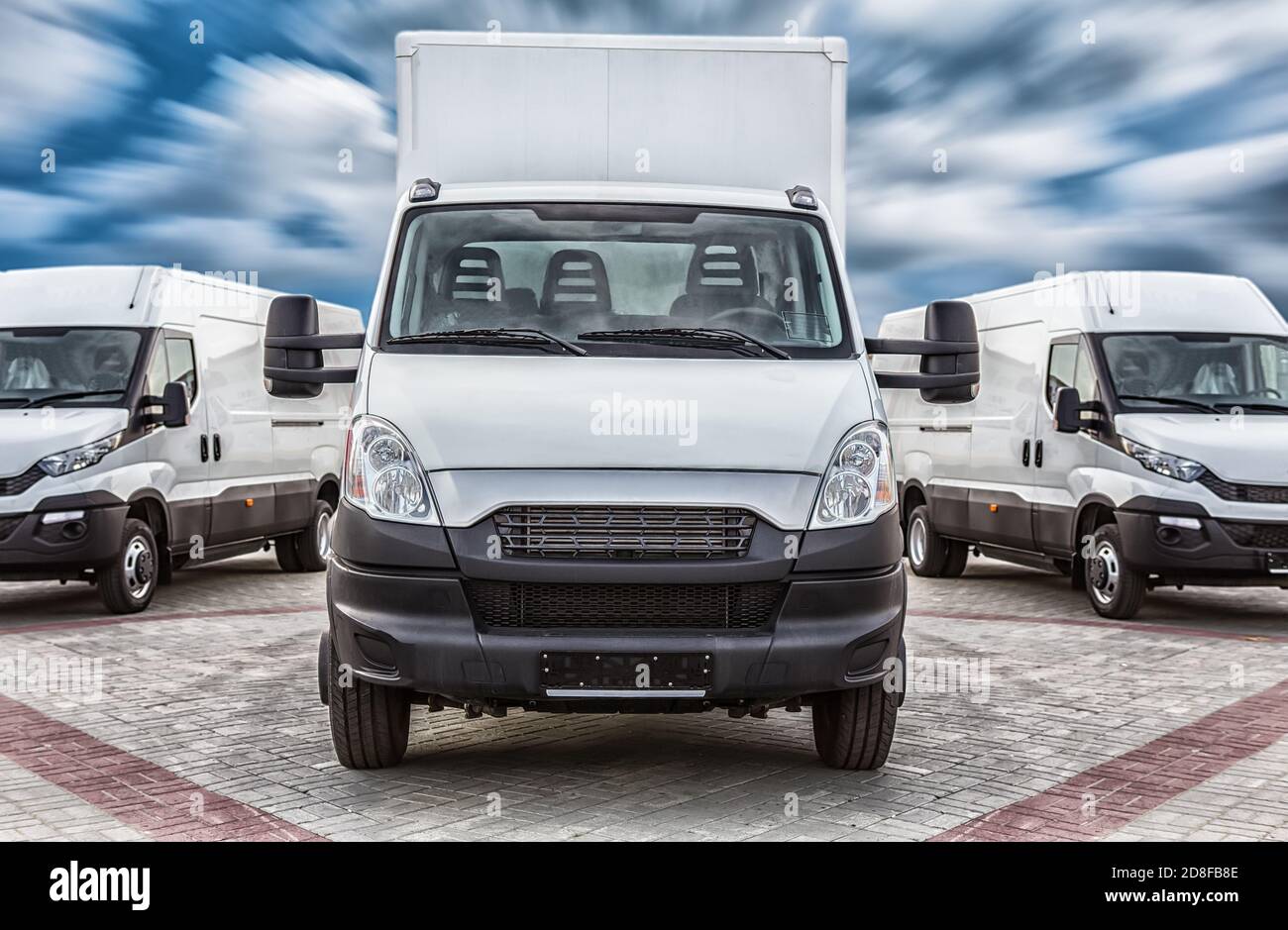 Transport truck and minivans cargo delivery Stock Photo - Alamy