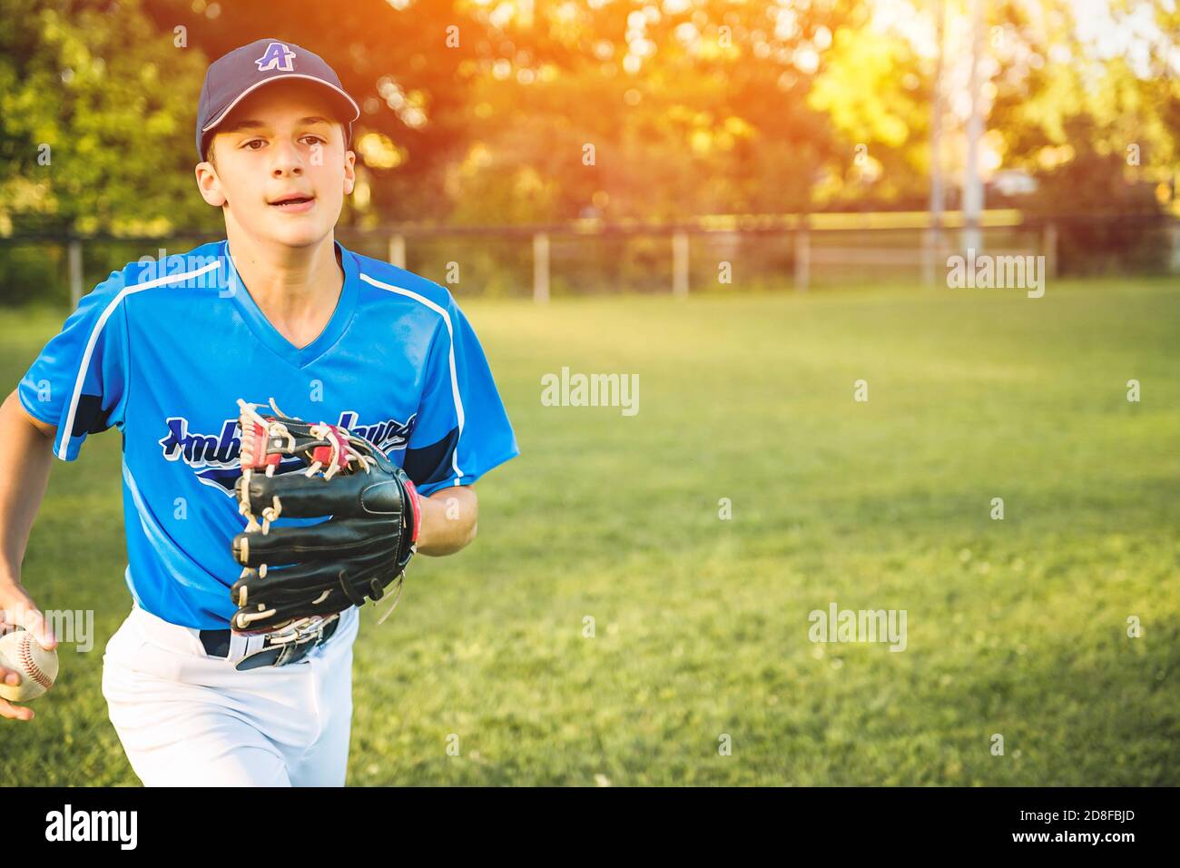 A children baseball players standing on the playground Stock Photo - Alamy
