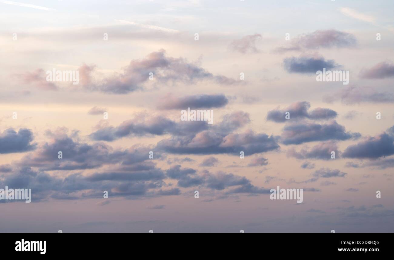 Cloudy sky at sunset or sunrise. Sky in the lilac and blue colors ...