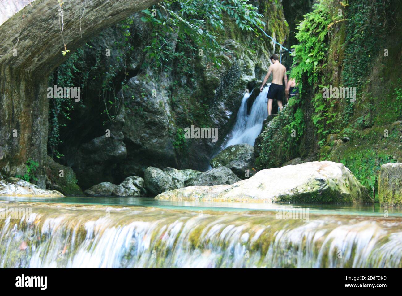 rocky bridge of candalla over the river waters in the Tuscan mountains ...