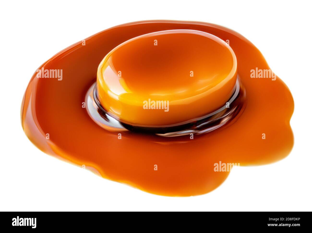 Caramel round candy and caramel sauce isolated on a white background ...