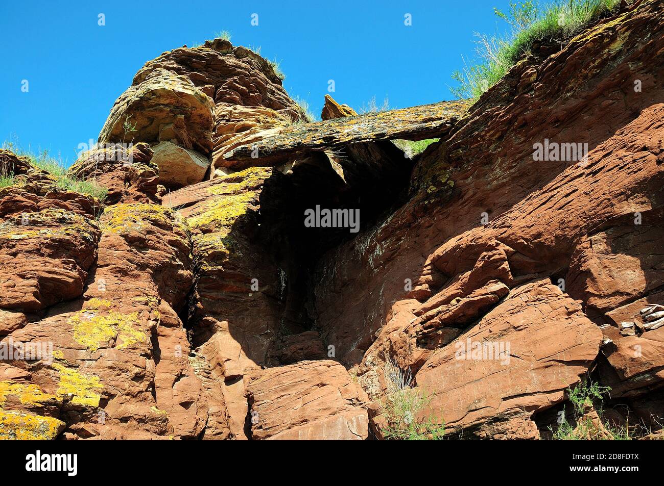 Remains of an ancient stone structure with a horizontal flat stone ...