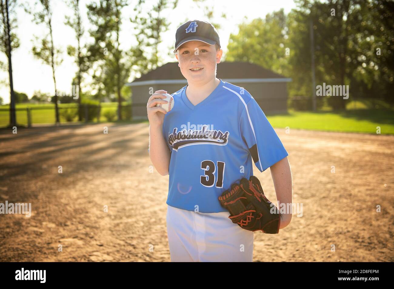 A children baseball players standing on the playground Stock Photo - Alamy