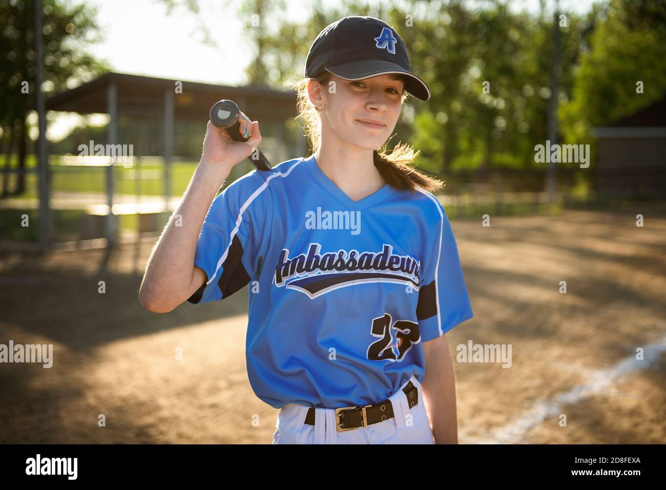Girl baseball bat hi-res stock photography and images - Alamy
