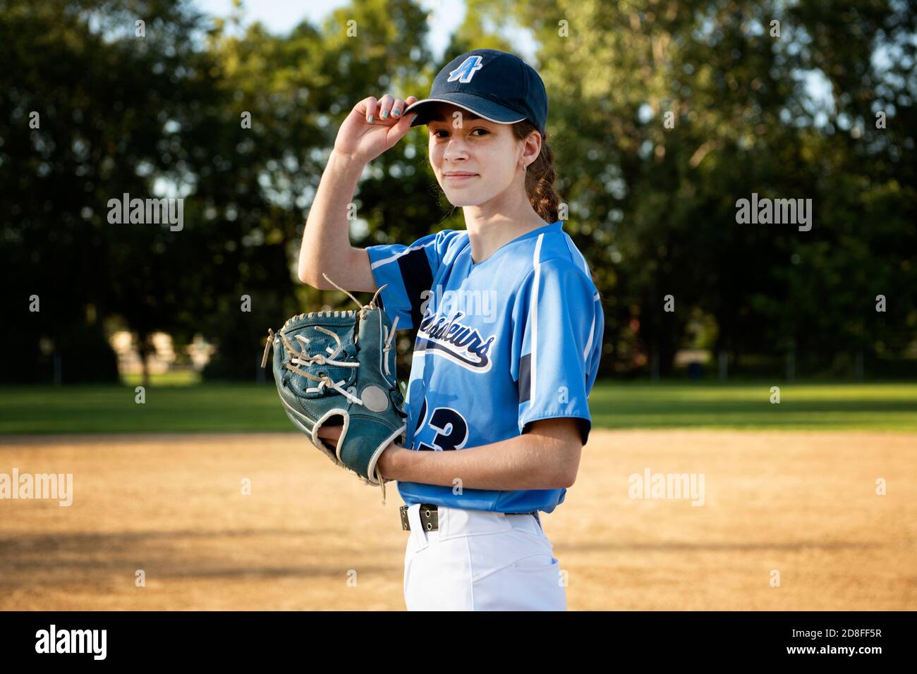 A children girl baseball players standing on the playground Stock Photo ...
