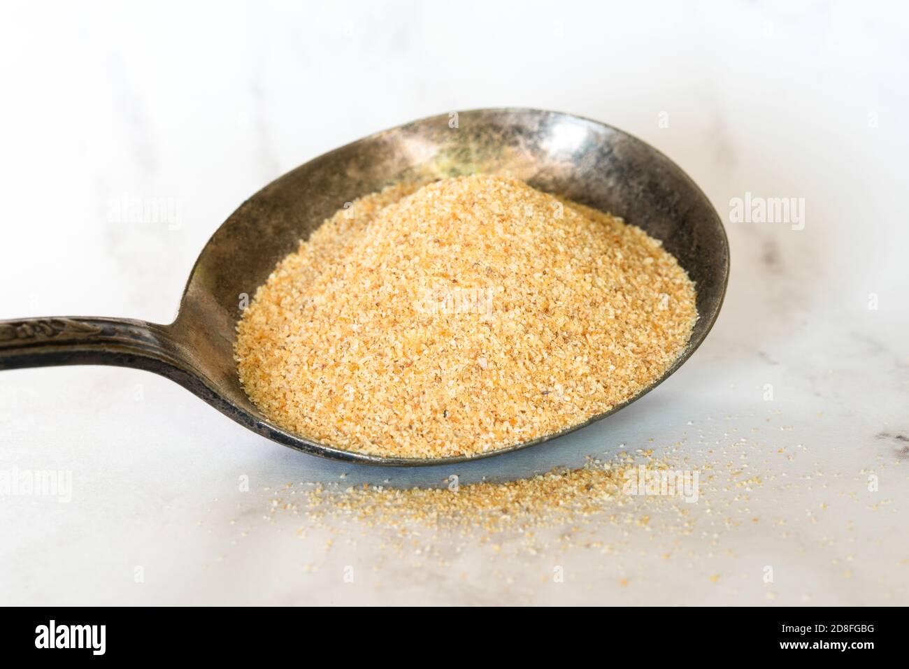 Garlic Powder Spilled form a Vintage Spoon Stock Photo - Alamy