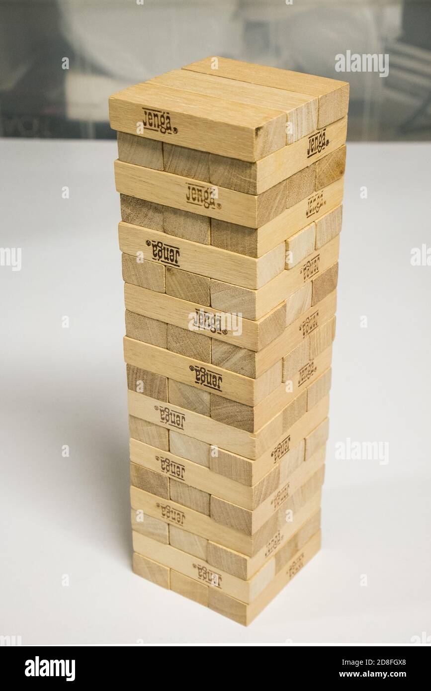 Jenga family game wooden block tower Stock Photo - Alamy