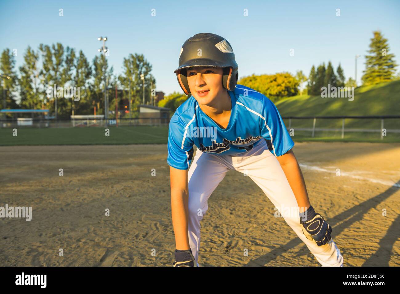 A children baseball players standing on the playground Stock Photo - Alamy