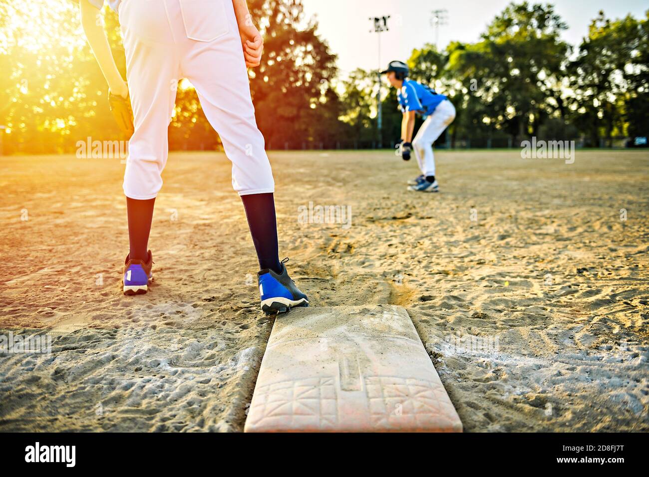 Group of two baseball players play together on the playground. On of ...