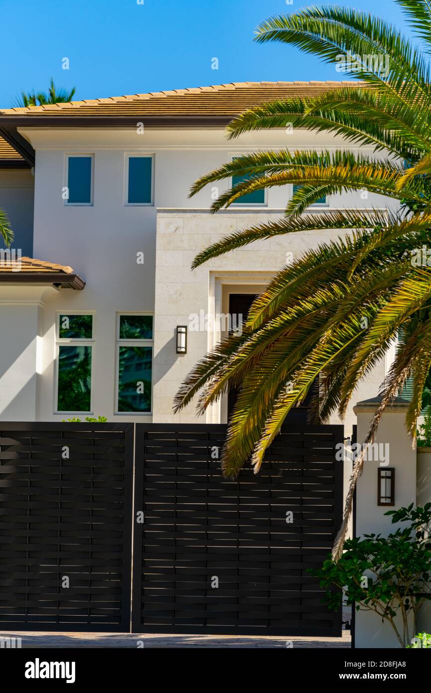 Upscale house with gate Stock Photo - Alamy
