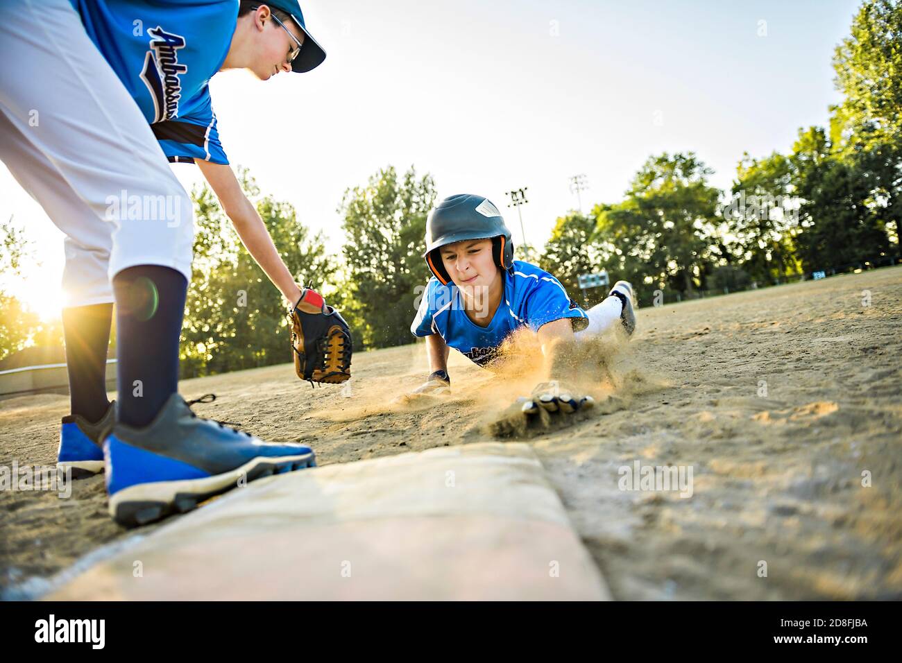Group of two baseball players play together on the playground. On of ...