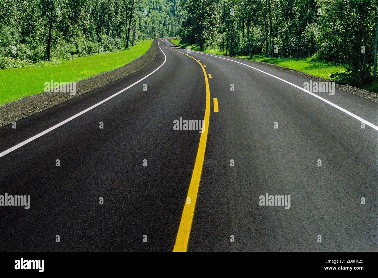 Empty asphalt road curves gently hi-res stock photography and images ...