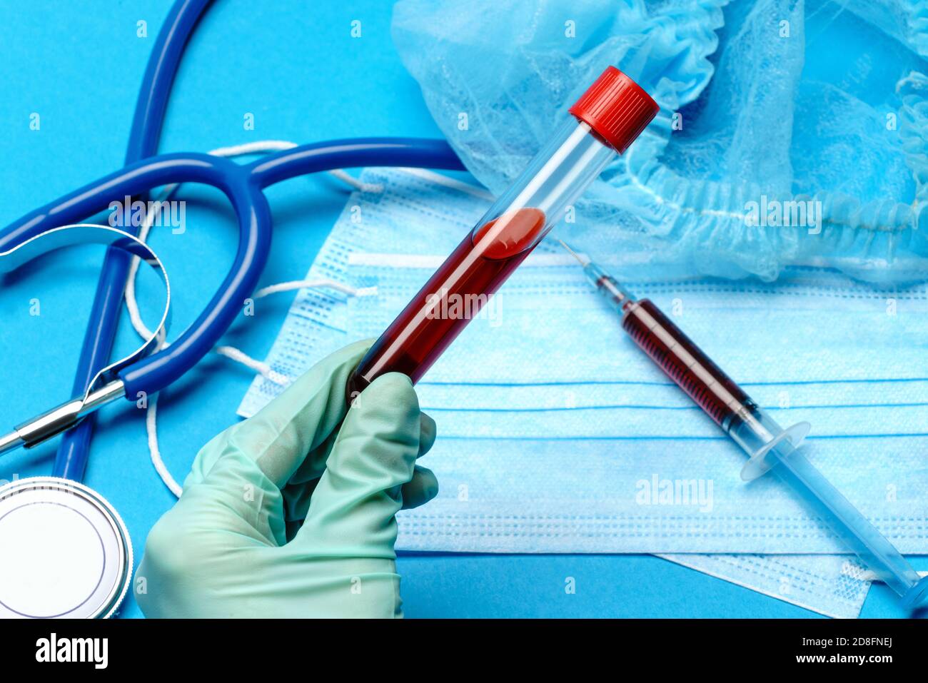 Lab assistant holding blood sample hi-res stock photography and images ...