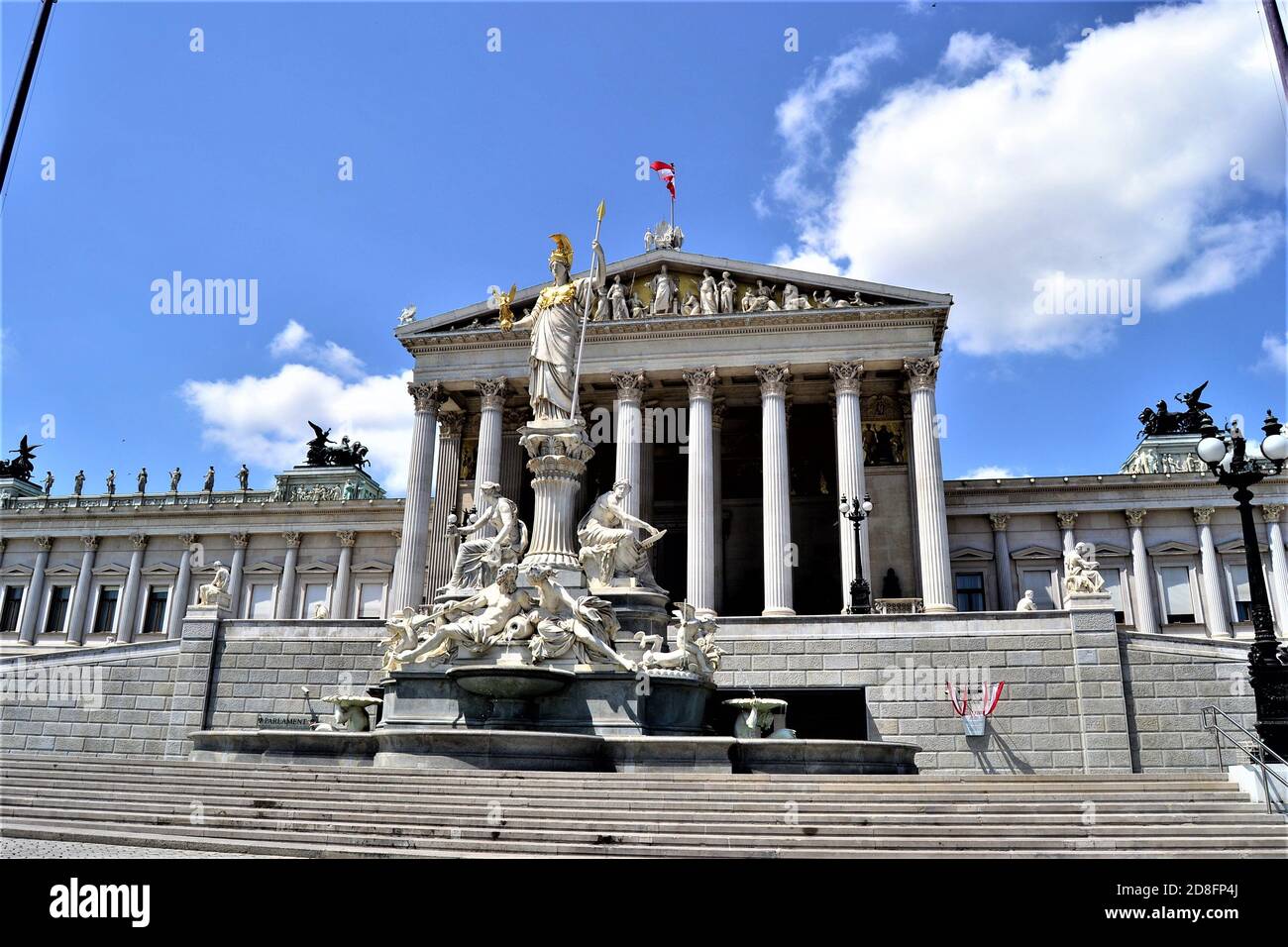 Vienna during sunny day and important statue. The Parliament Building ...