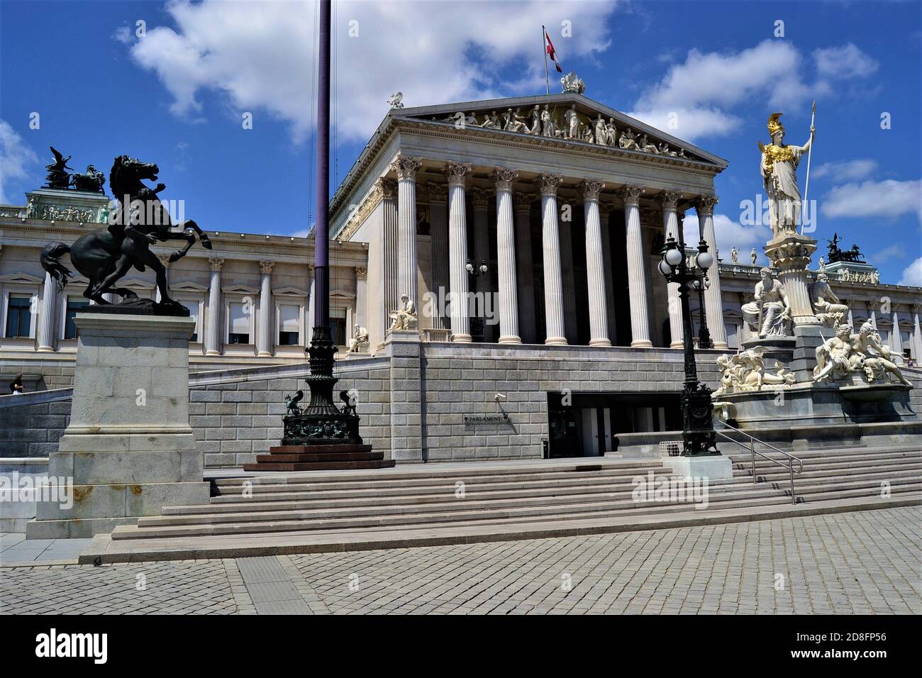 Vienna during sunny day and important statue. The Parliament Building ...