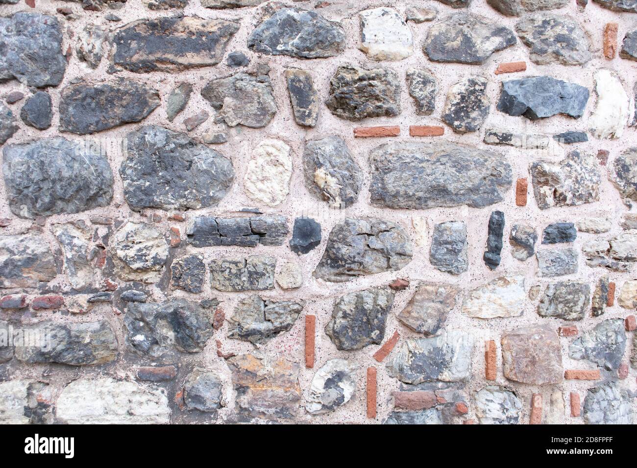 Centuries old ancient stone tower wall background Stock Photo - Alamy