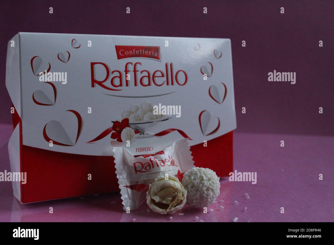 white candies round and halves in the background is a square ...